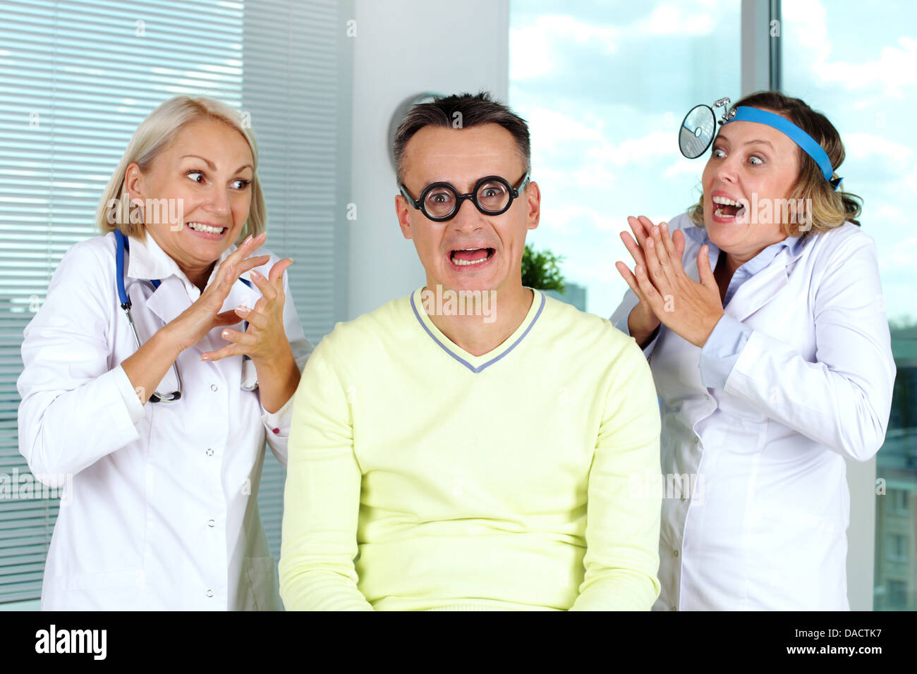 Portrait of a patient being scared of the doctors rubbing their hands ...