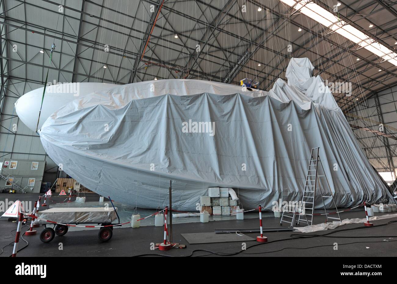 A Zeppelin NT receives a new hull during an overhaul in the hangar in ...