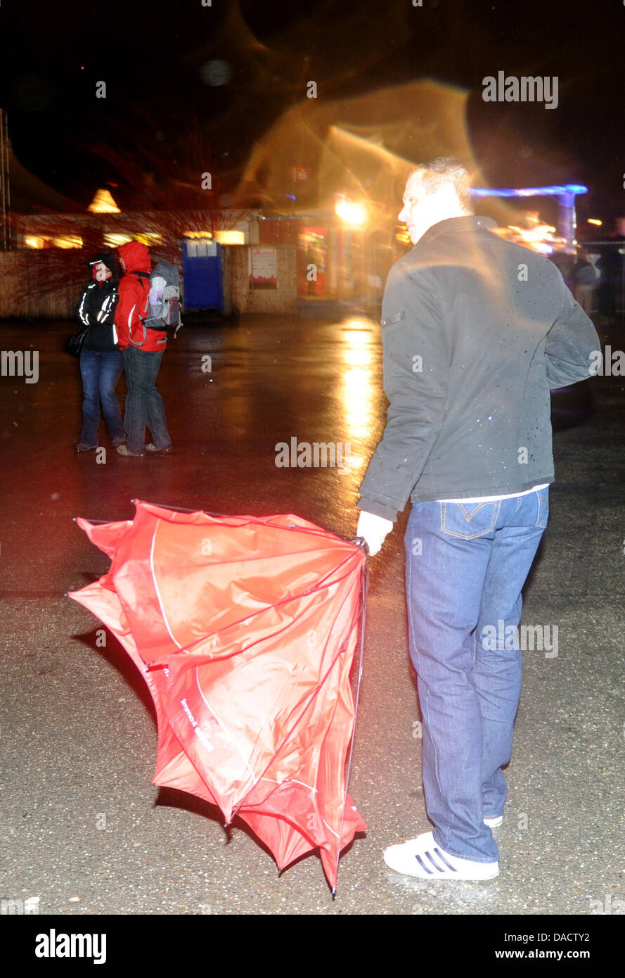 A man fight against the wind with an umbrella in Munich, Germany, 16 ...