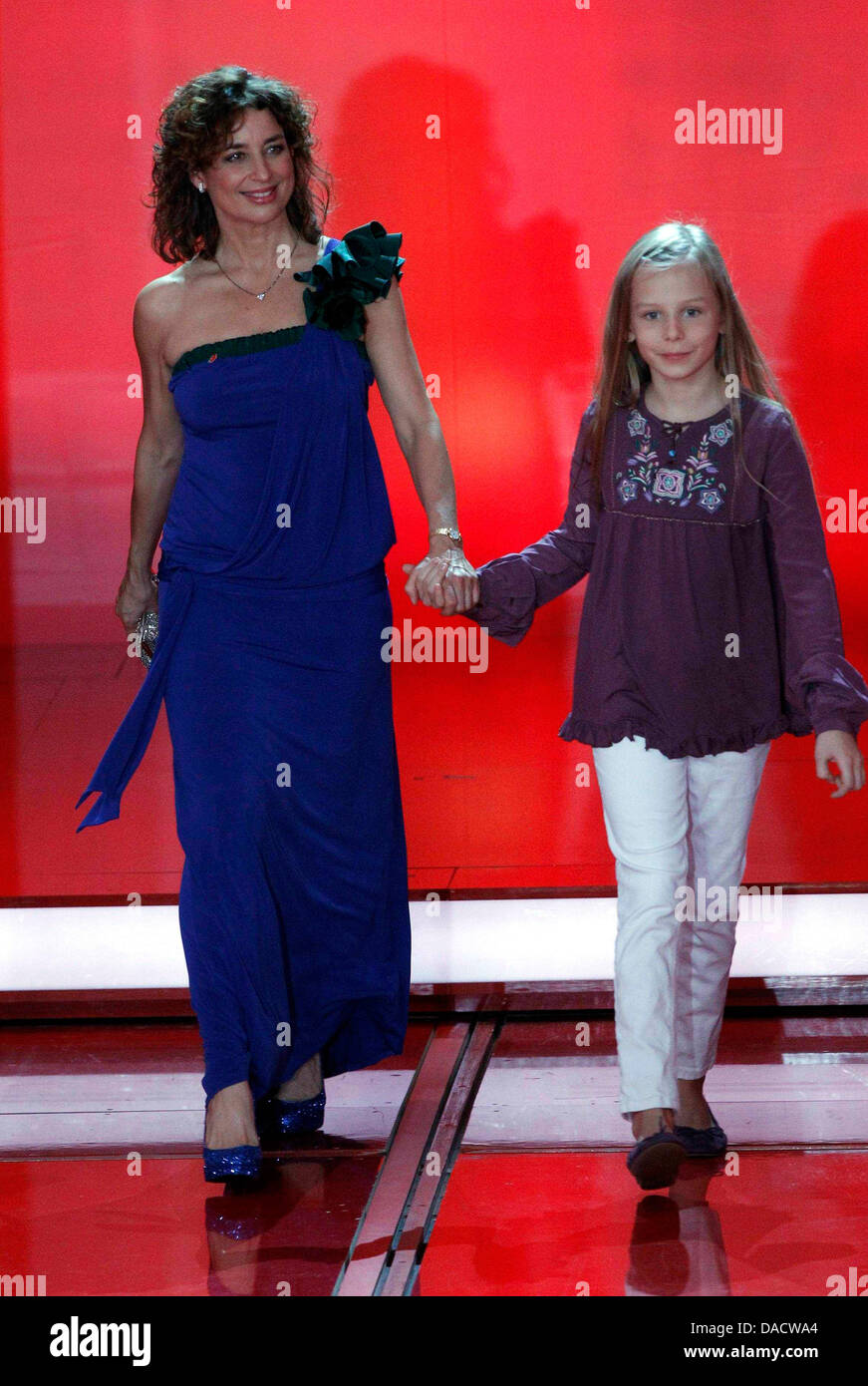 Isabel Varell walks to answer at the phone for donations during the ...