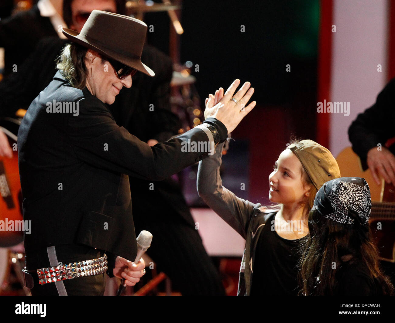 German musician Udo Lindenberg performs with young singers during the ...