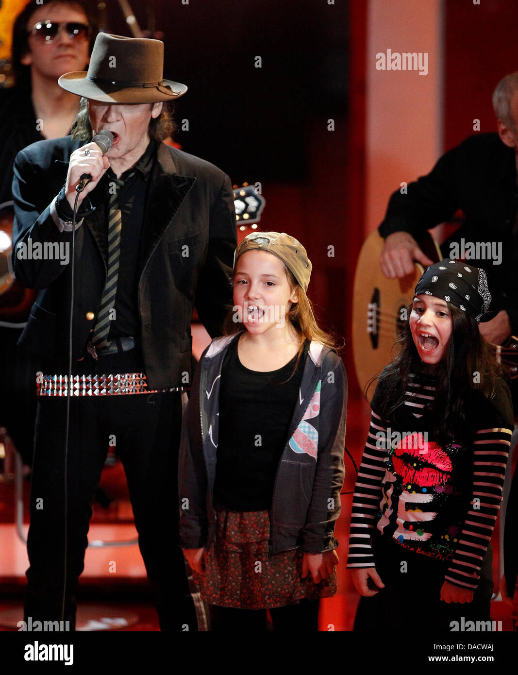 German musician Udo Lindenberg performs with young singers during the ...