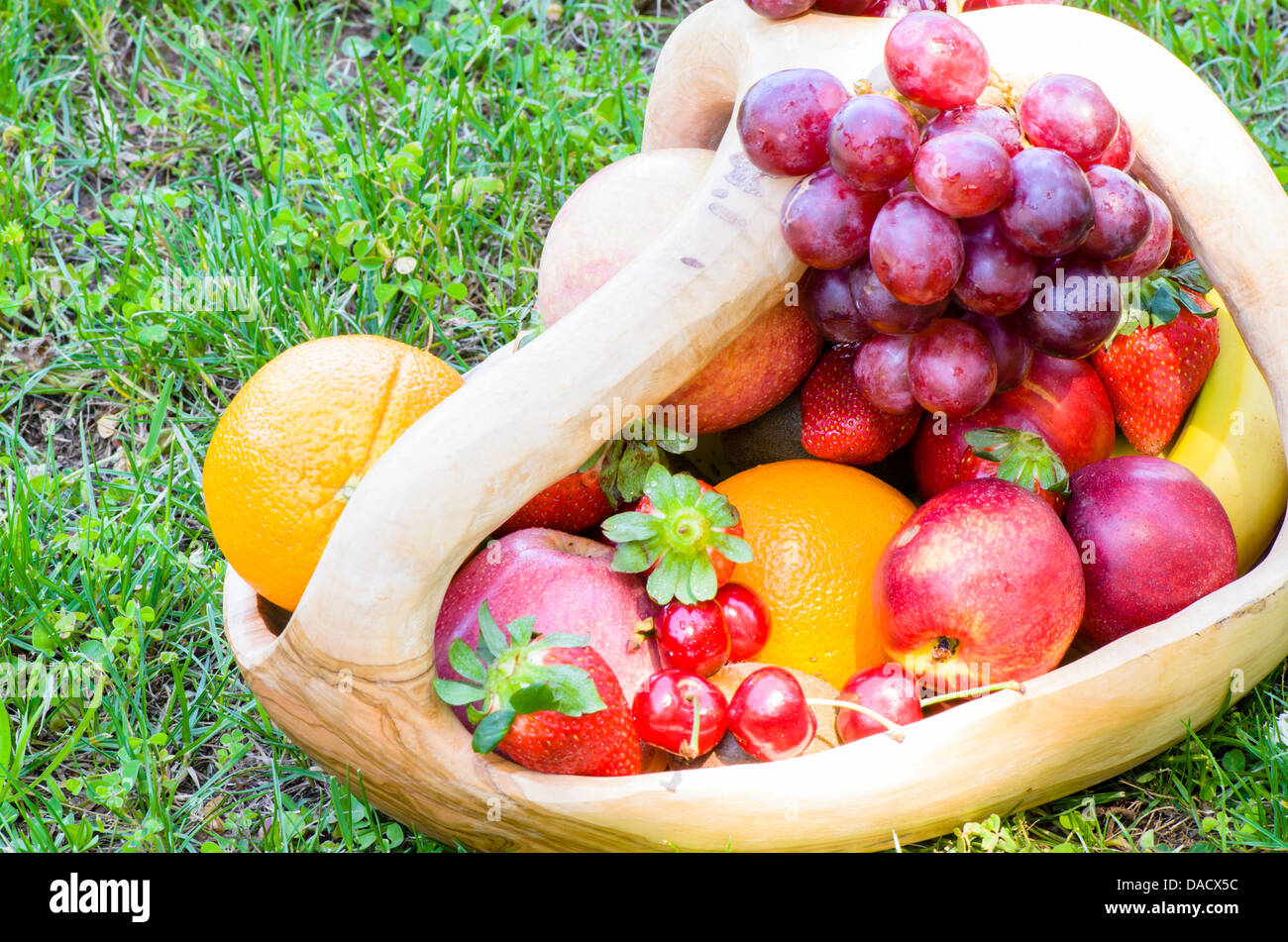 Rustic basket with fruits Stock Photo - Alamy