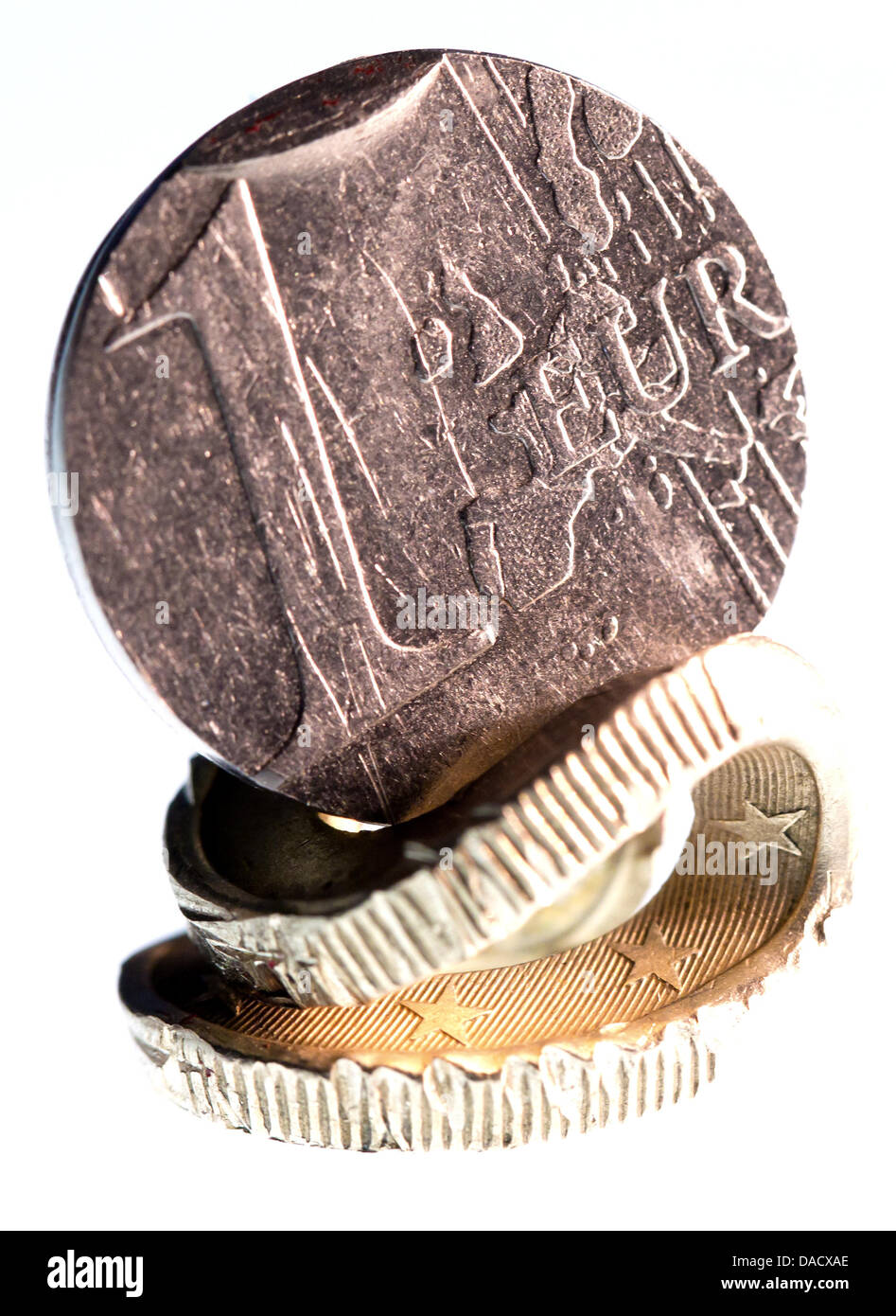 ILLUSTRATION - This illustration shows a bent and damaged euro coin on ...