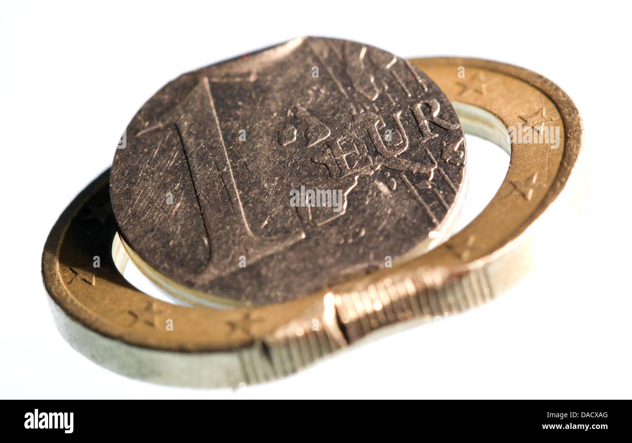 ILLUSTRATION - This illustration shows a bent and damaged euro coin on ...