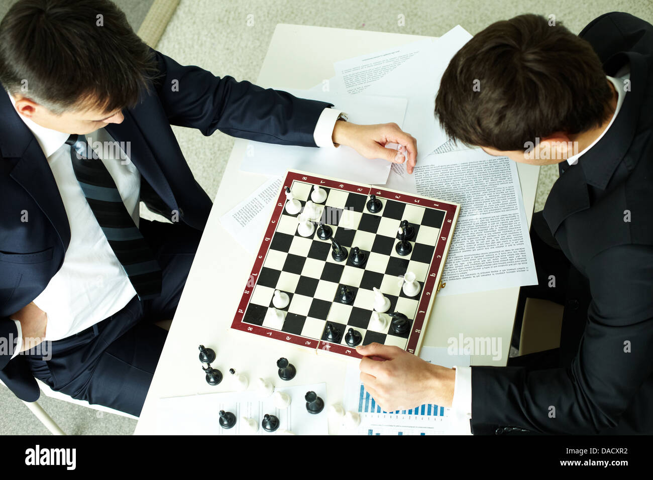 The above view of business partners playing chess, conceptual image ...