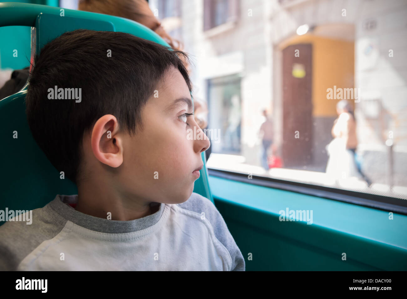 Baby looking out bus window hi-res stock photography and images - Alamy