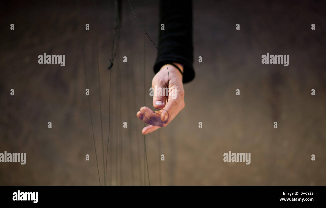 The hand of a puppeteer controls a puppet at the German Sorbian ...