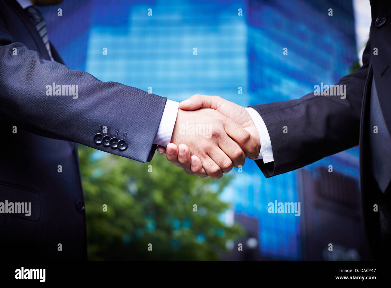 Close-up of business people welcoming each other in the downtown Stock ...