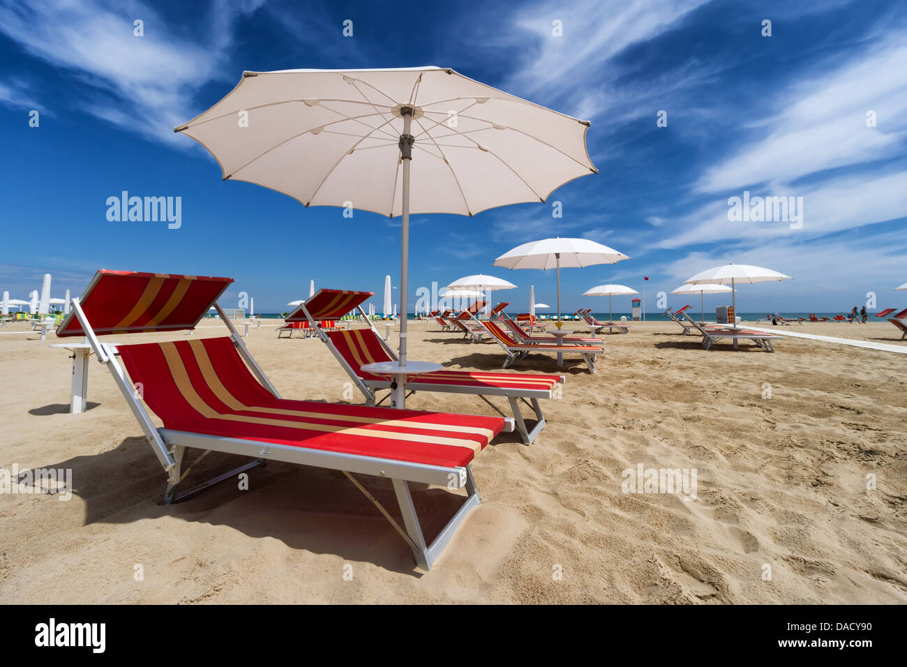 Umbrellas and sunbeds in Rimini and Riccione Beach, Italy Stock Photo ...