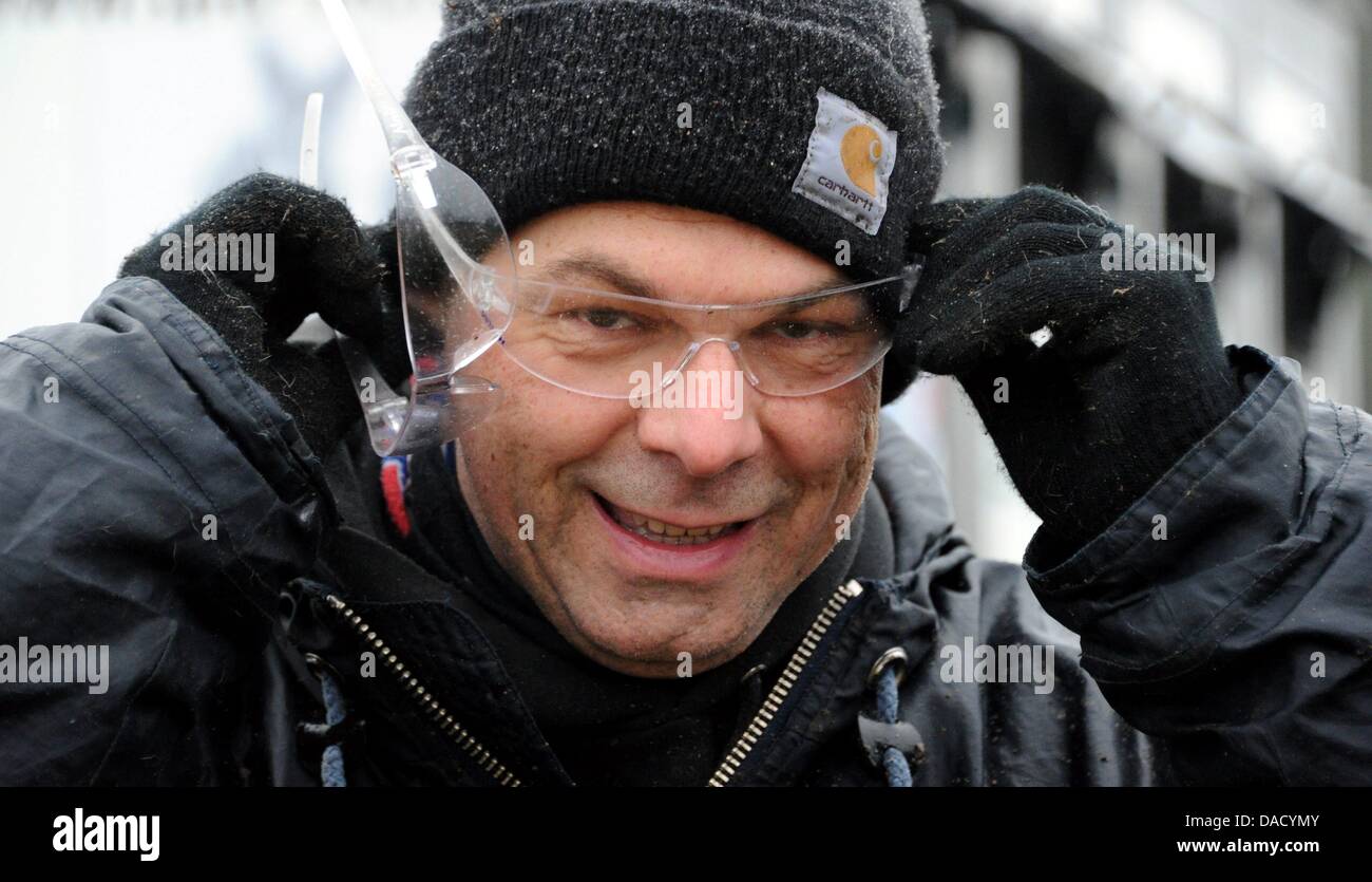 Michael Tetzner puts on his safety glasses prior to a practice lap with ...