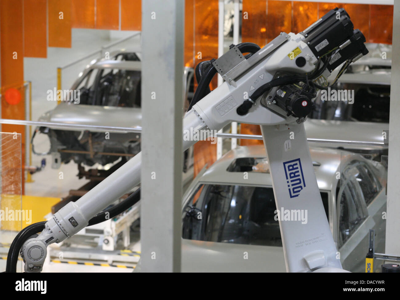 A robot works at the Volkswagen factory in Nanjing near Shanghai, China ...