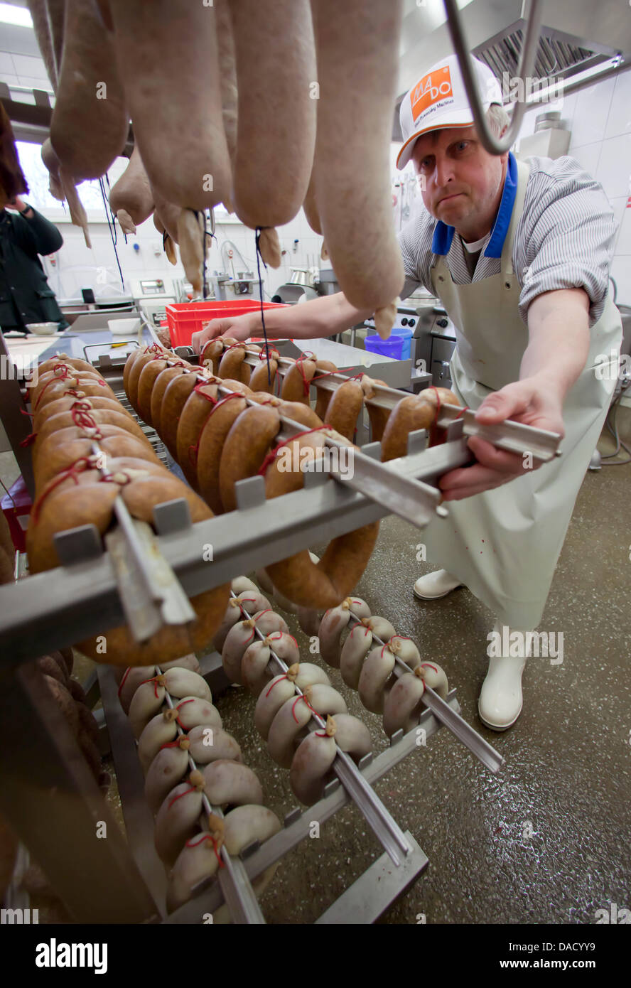 Butcher Udo Neumann pushes a wagon with fresh sausages organic butchers ...