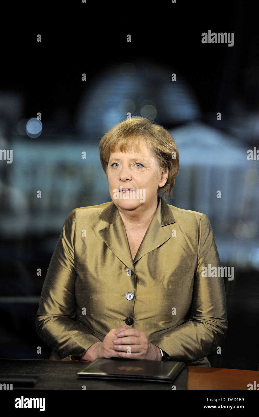 German Chancellor Angela Merkel poses for photographs after the ...