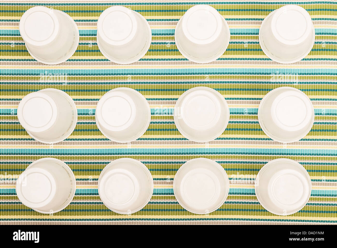 Lots of disposable cups on a colorful background Stock Photo - Alamy