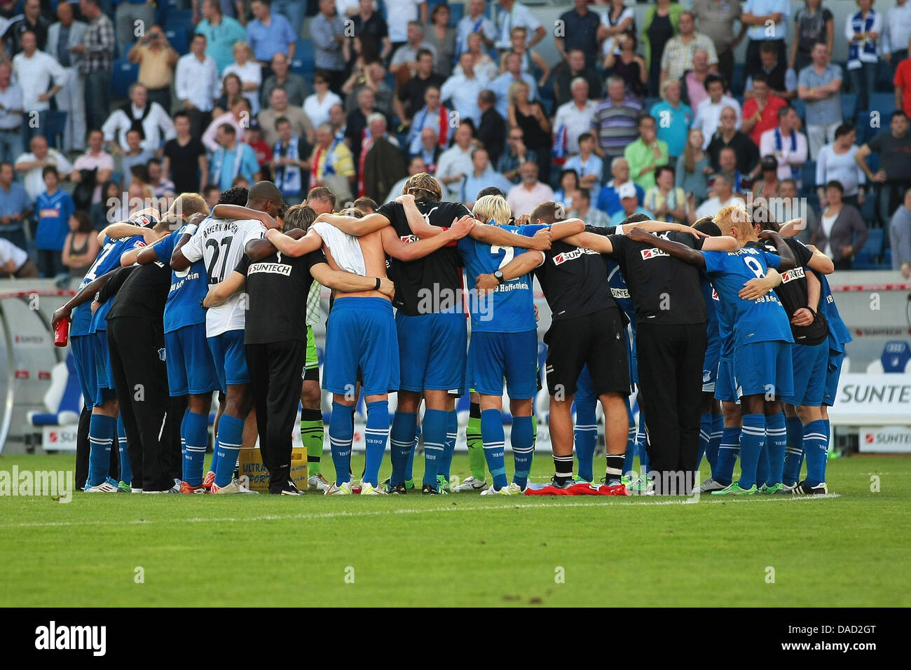 Hoffenheim's team huddles after the German Bundesliga soccer match ...