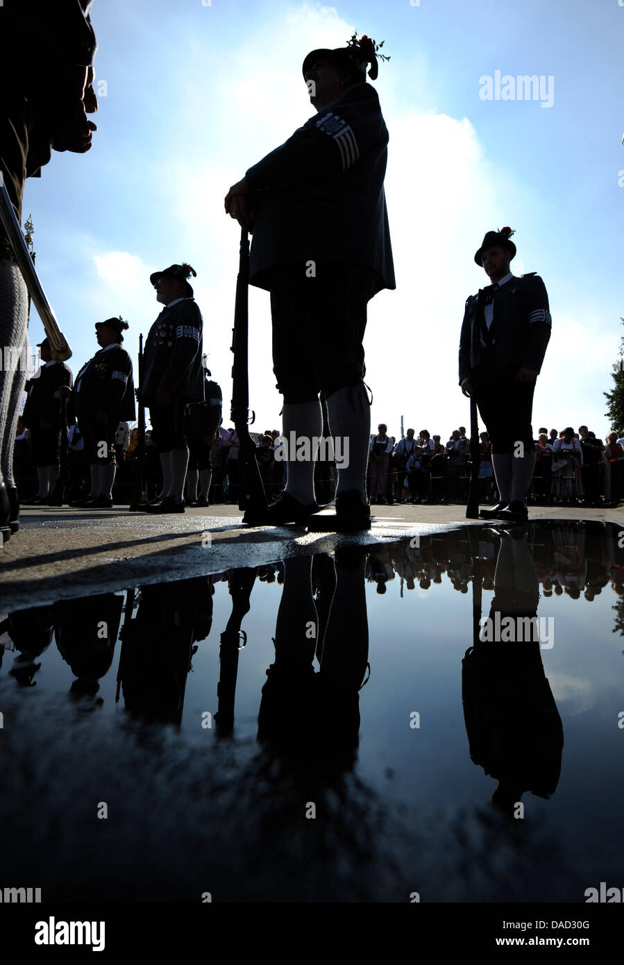Men in Bavarian clothes hold their salute guns prior to the traditional ...