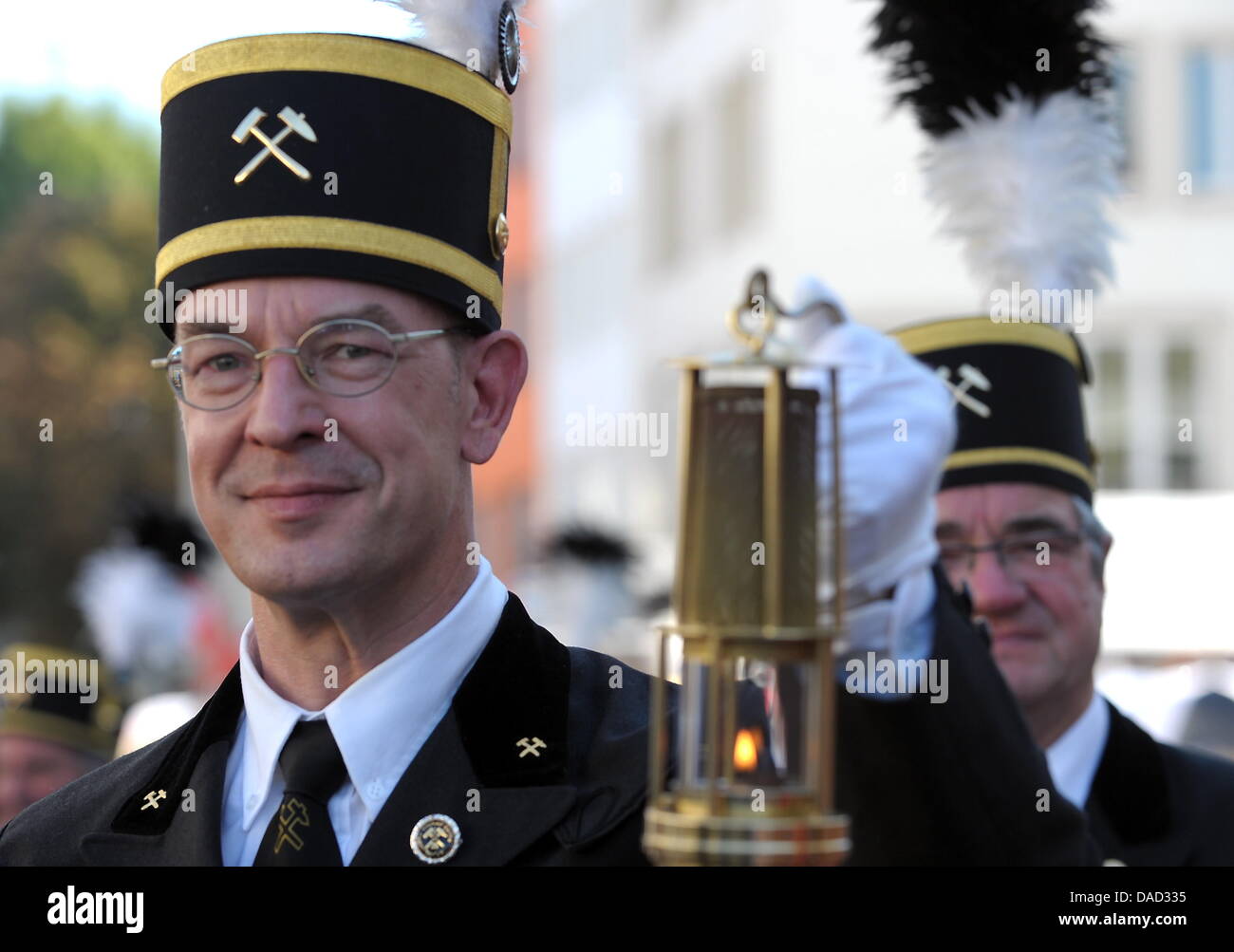 Men in traditional Bavarian garb participate in a parade on German ...