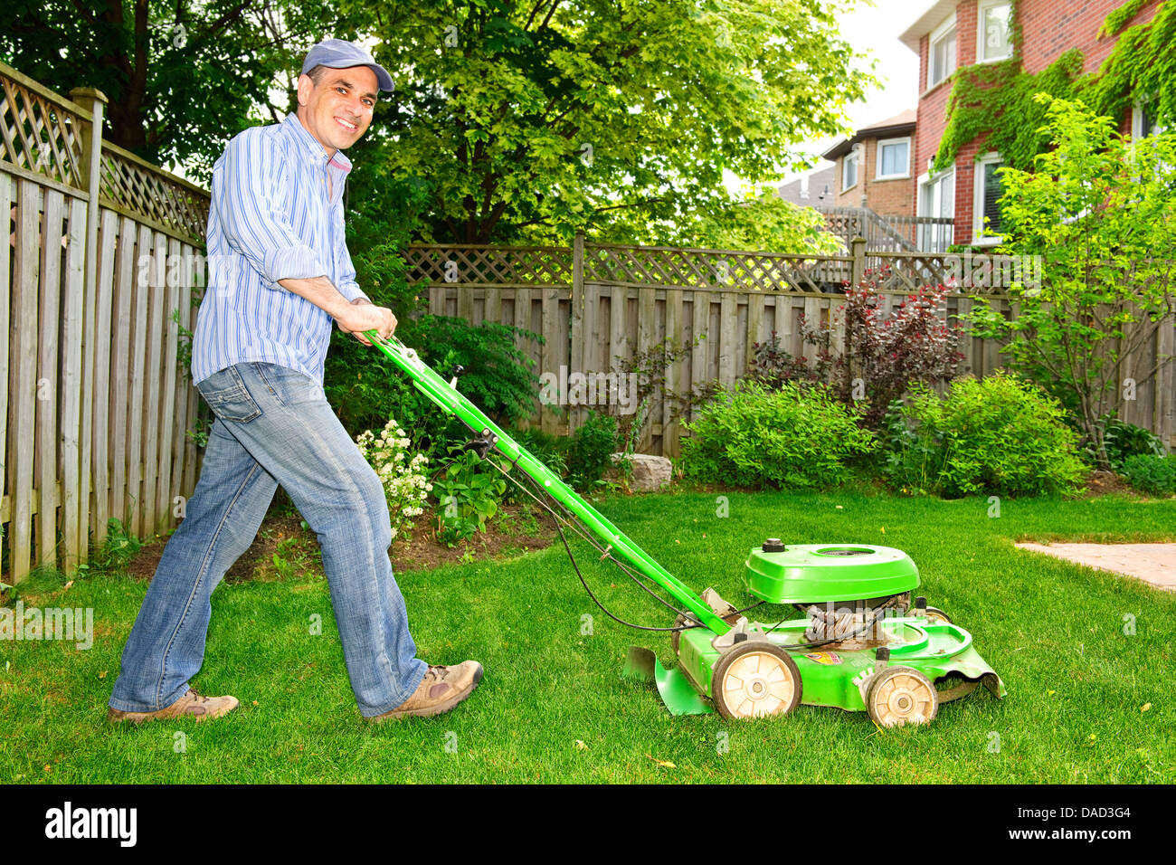 Man mowing lawnmower cut grass hi-res stock photography and images - Alamy