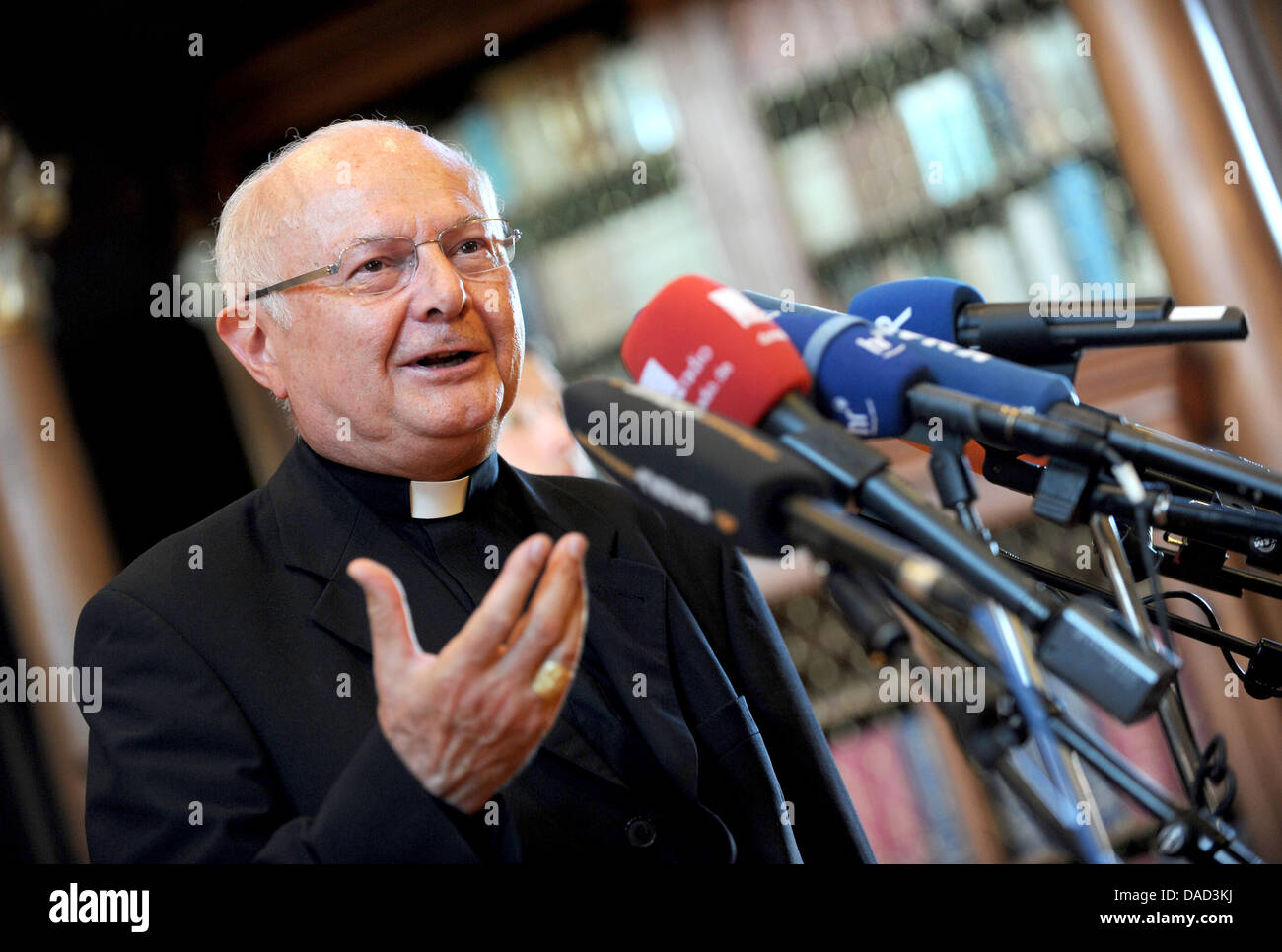 Robert Zollitsch, chairman of the German Bishops' Conference, talks to ...