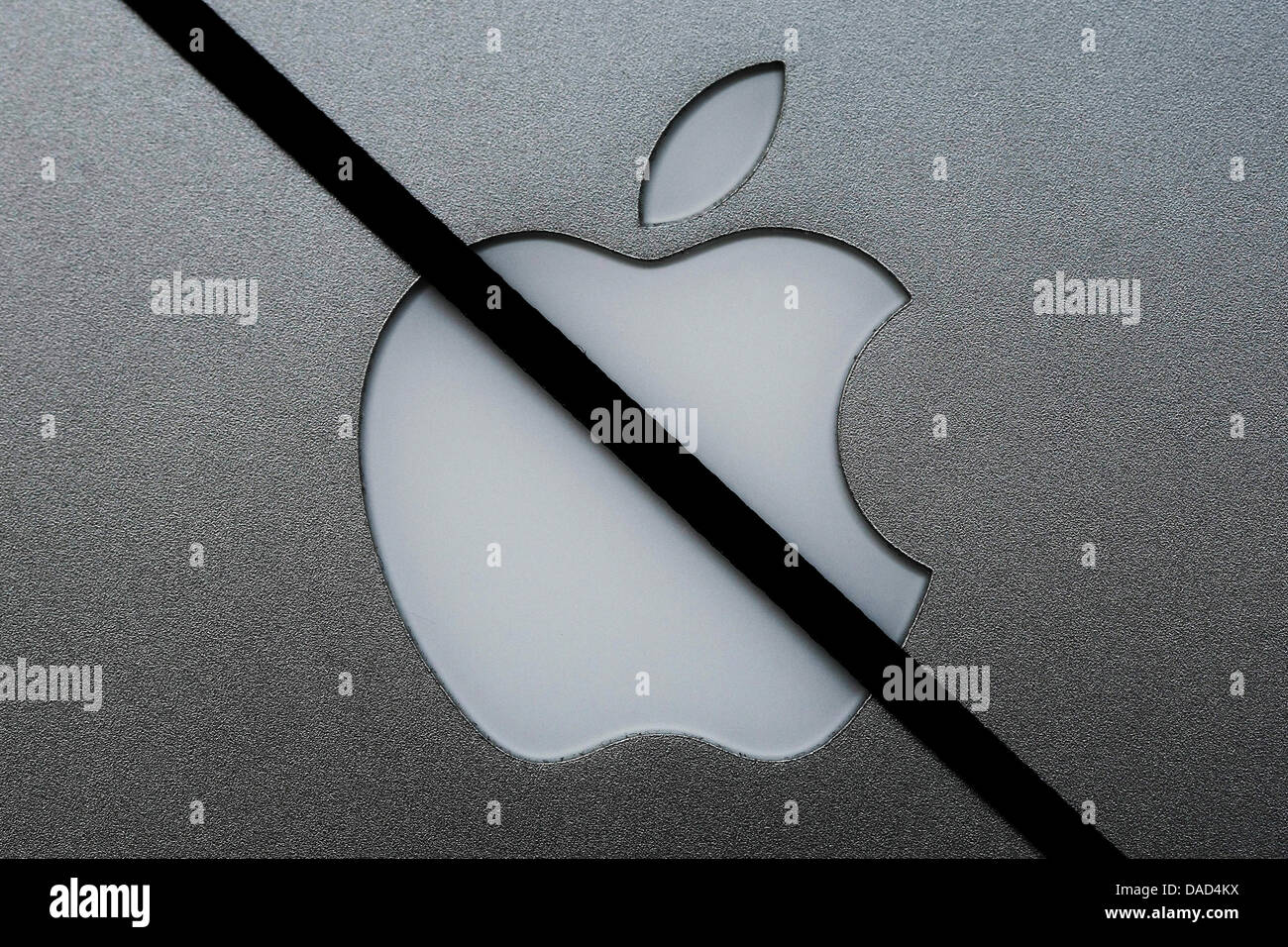 ILLUSTRATION - A black ribbon lies on the logo of the multinational ...