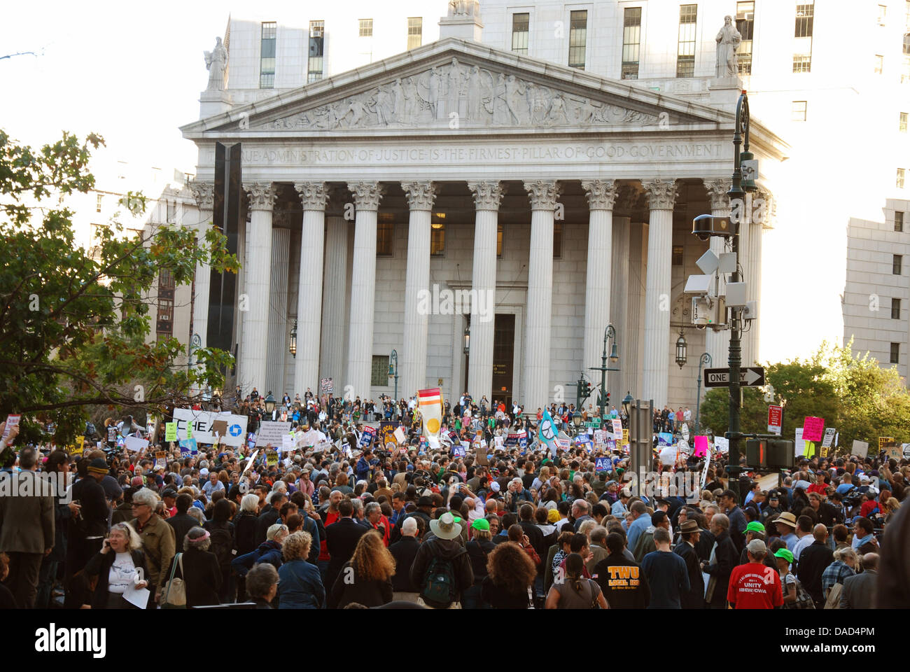 Thousends of demonstrators protest with posters in front of the town ...