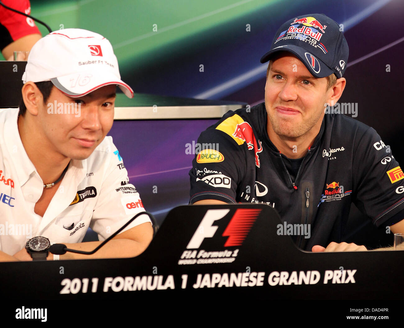 German Formula One driver Sebastian Vettel of Red Bull Racing (R) talks ...