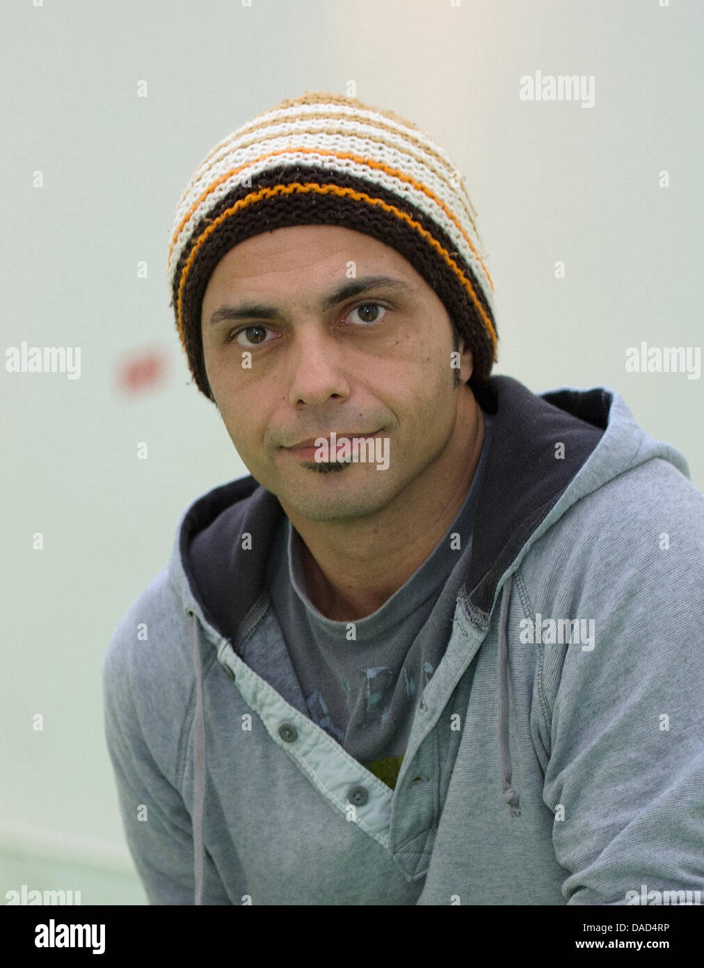 Selatin Kara sits on a railing at the Kammer theatre in Stuttgart ...