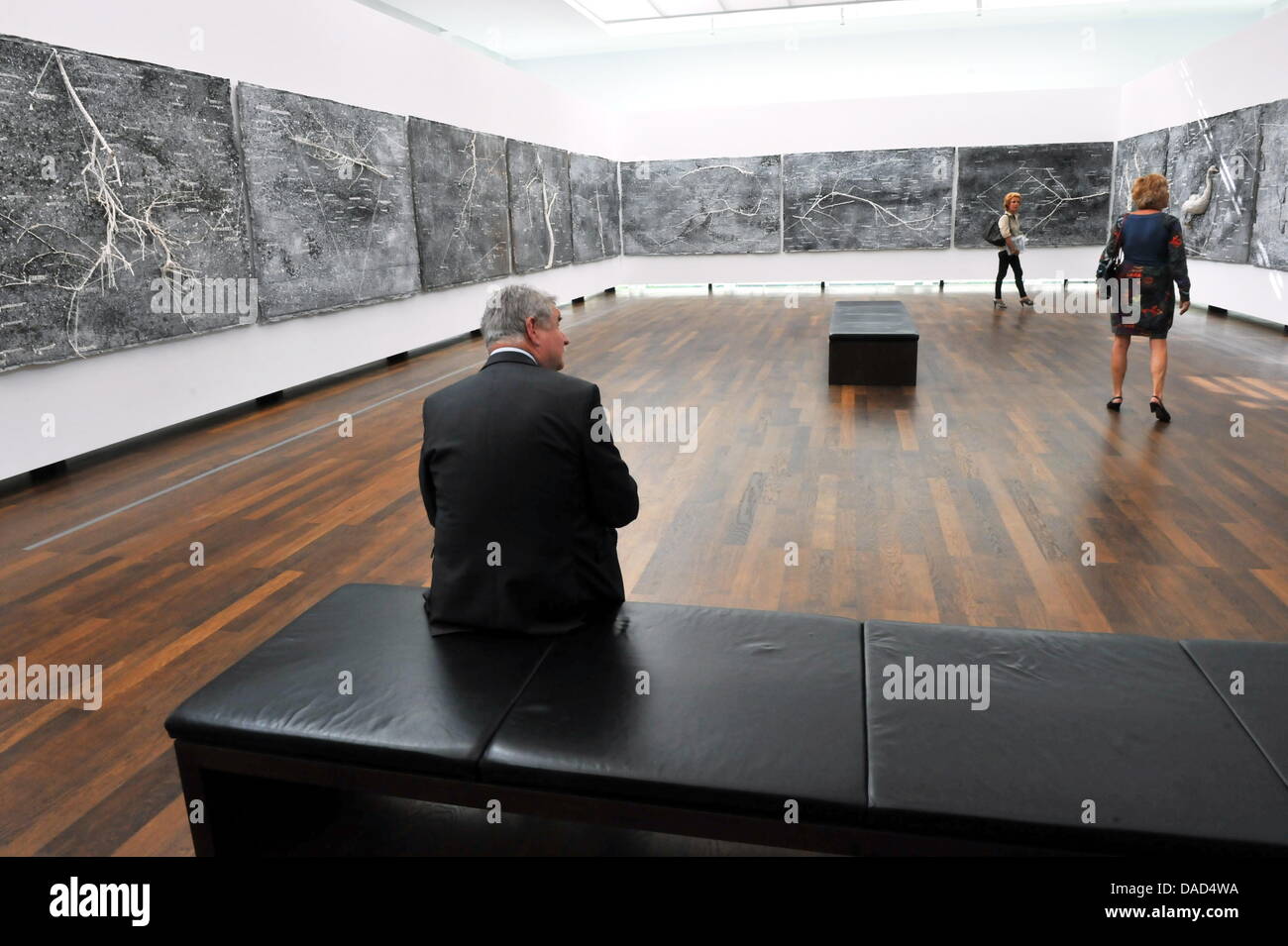 Visitors observes the series of paintings 'The Secret Life of Plants ...