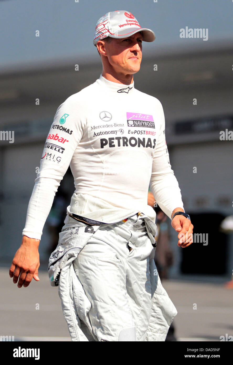 German Formula One driver Michael Schumacher of Mercedes GP walks ...