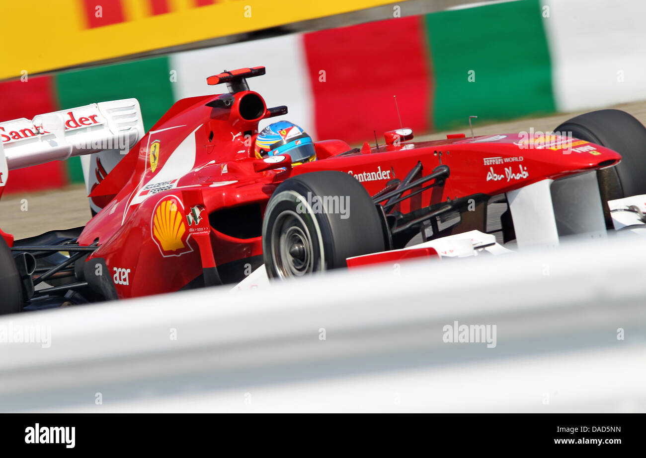 Spanish Formula One driver Fernando Alonso of Ferrari steers his car ...