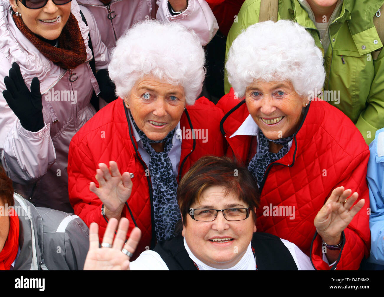 The twins Marta and Eva wave and smile during the 3rd International ...