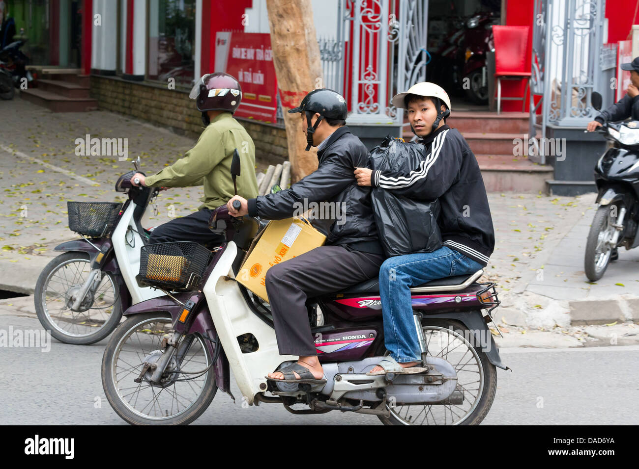Scooter Drivers in Hanoi, Vietnam Stock Photo - Alamy