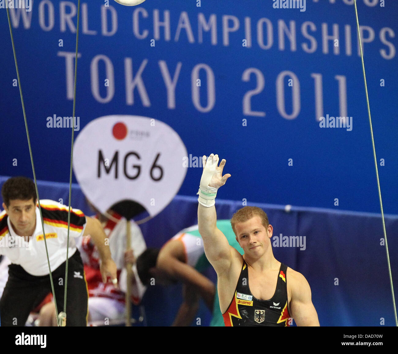 Fabian Hambüchen of Germany is waving after performing on the rings ...