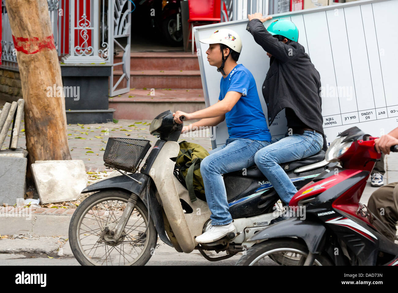 Scooter Drivers in Hanoi, Vietnam Stock Photo - Alamy