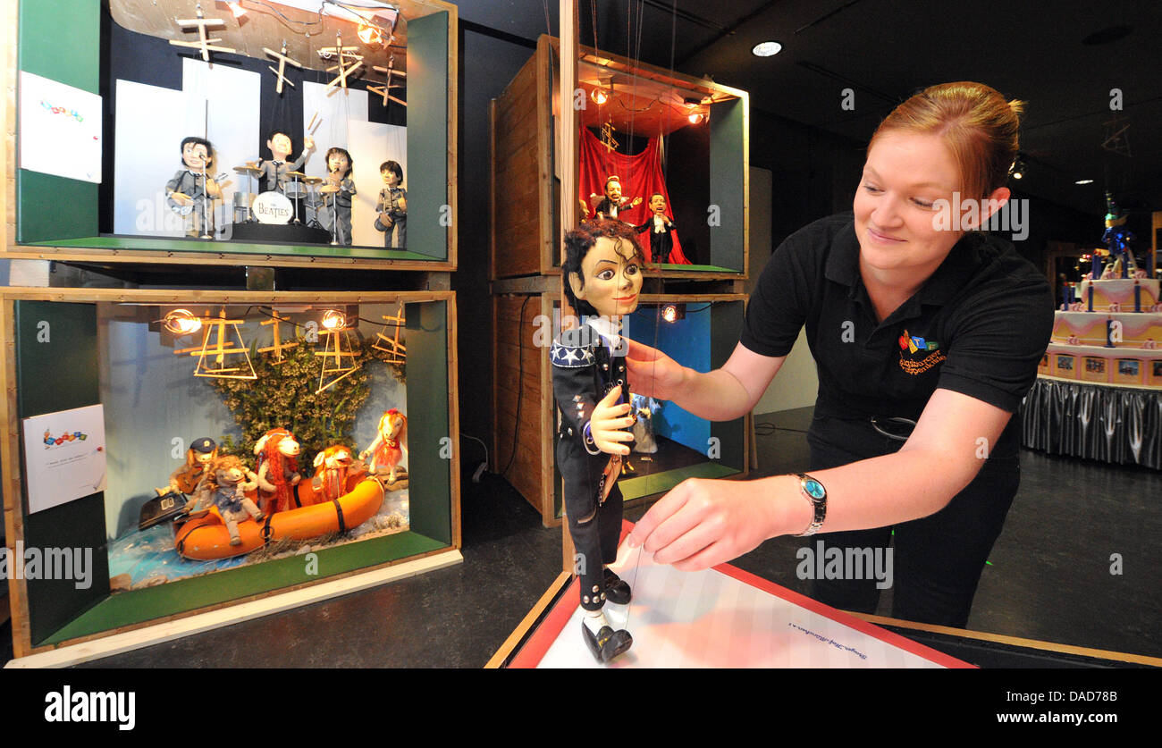 Melanie Marschall places a puppet of Michael Jackson in front of ...