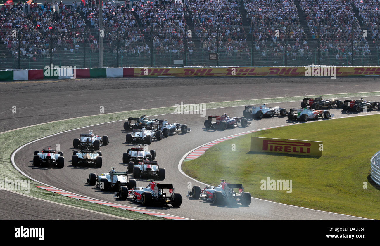Formula One drivers steer their cars during the Japan Formula One Grand ...