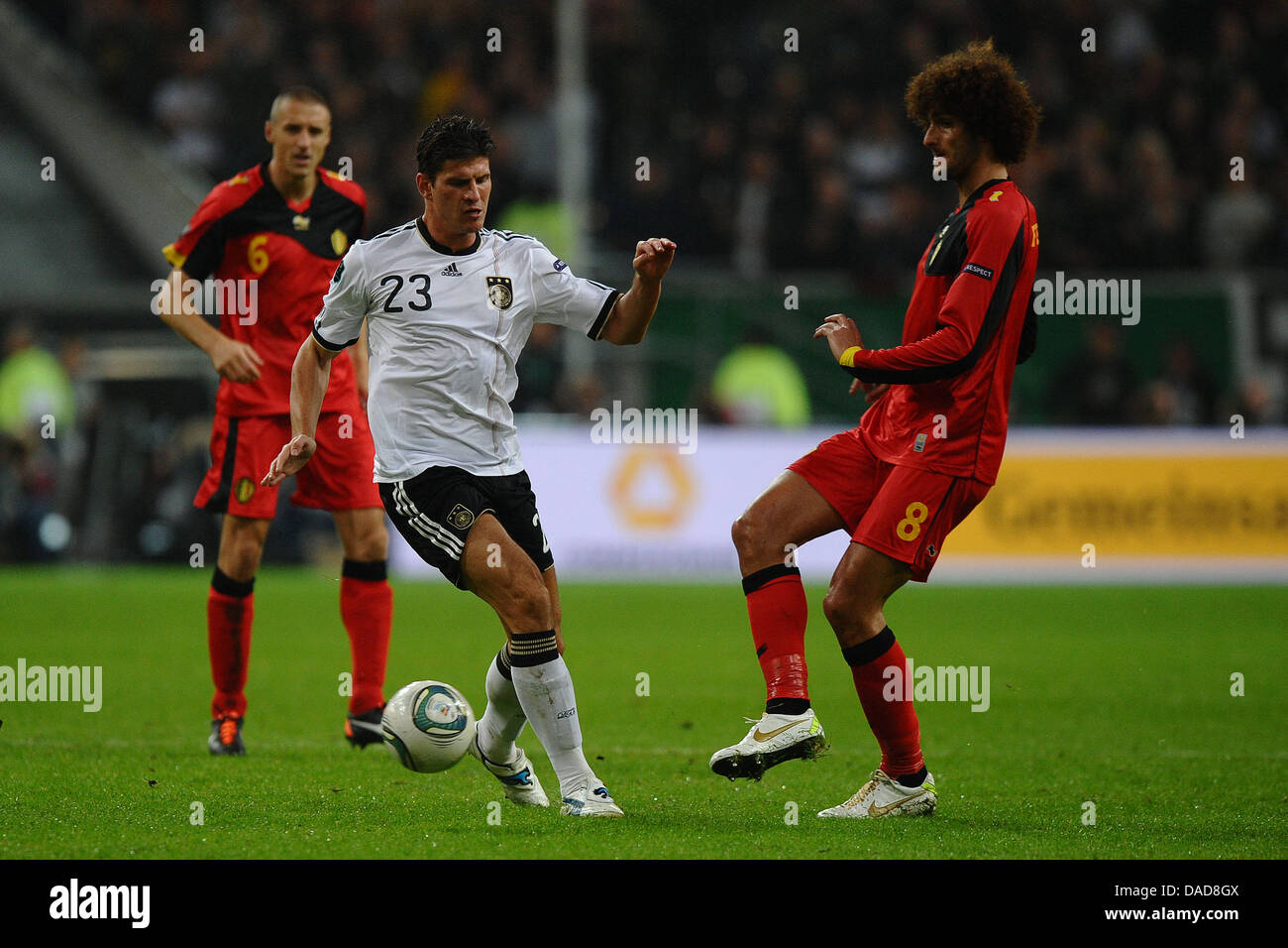 Belgium's Marouane Fellaini (R) vies for the ball with Germany's Mario ...