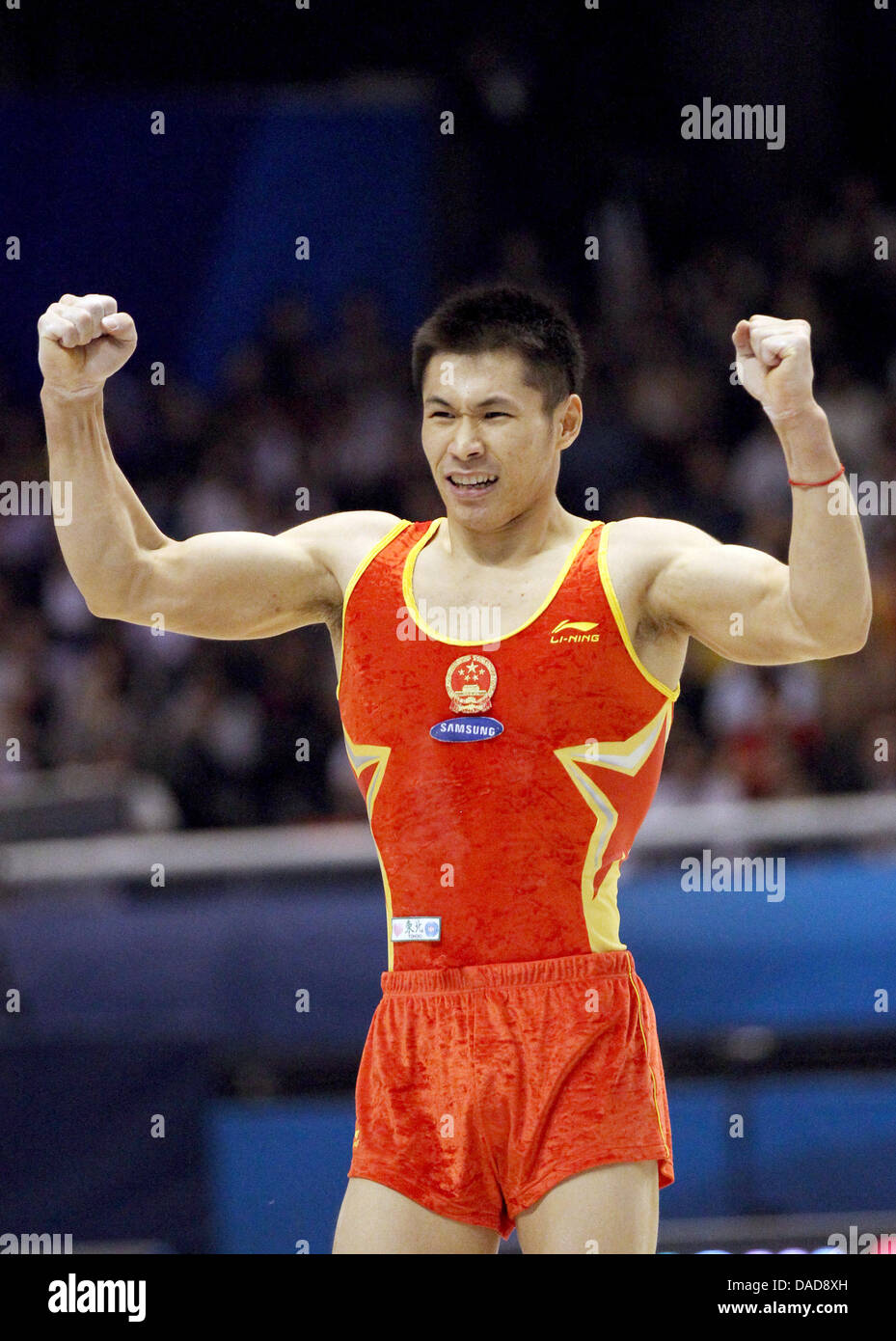 Chenglong Zhang of China celebrates after his floor performance during ...