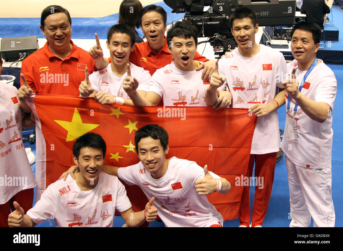 Gold medal winning gymnasts of China celebrate after the men's team ...