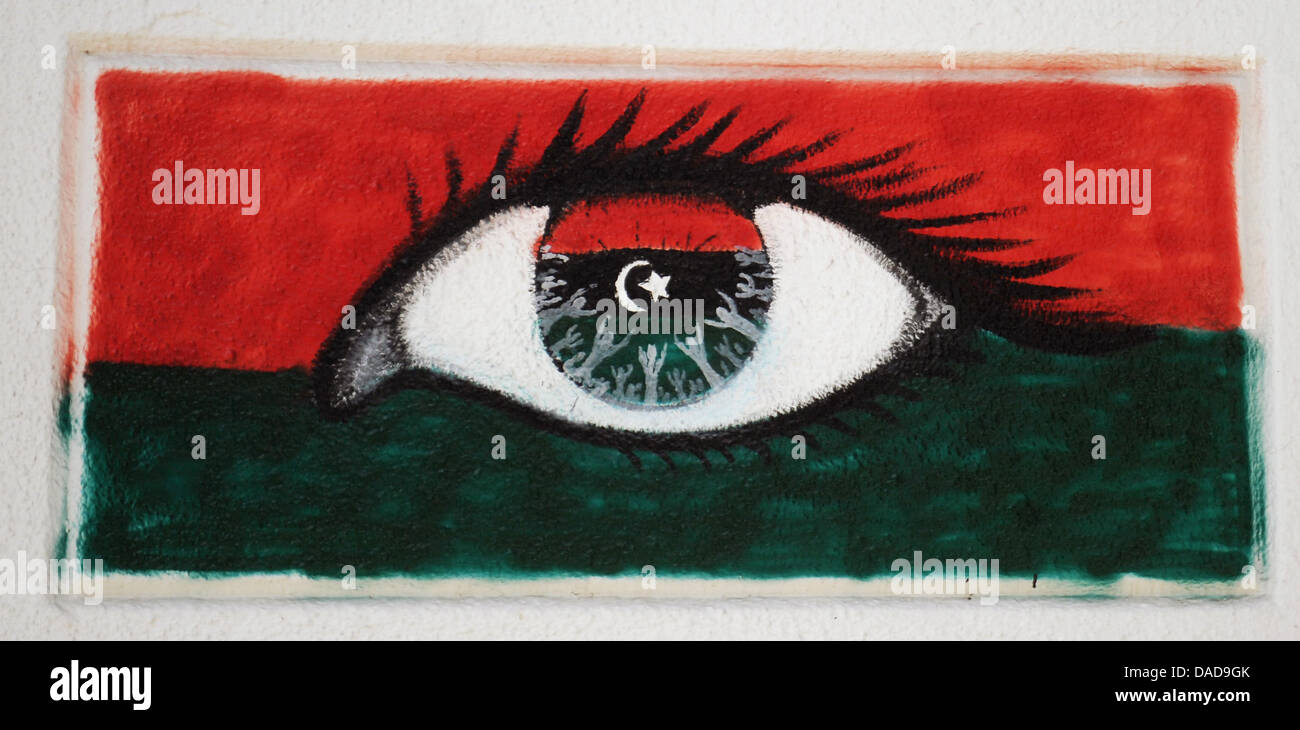 An eye with the colors and symbols of the new Libyan flag is painted on ...