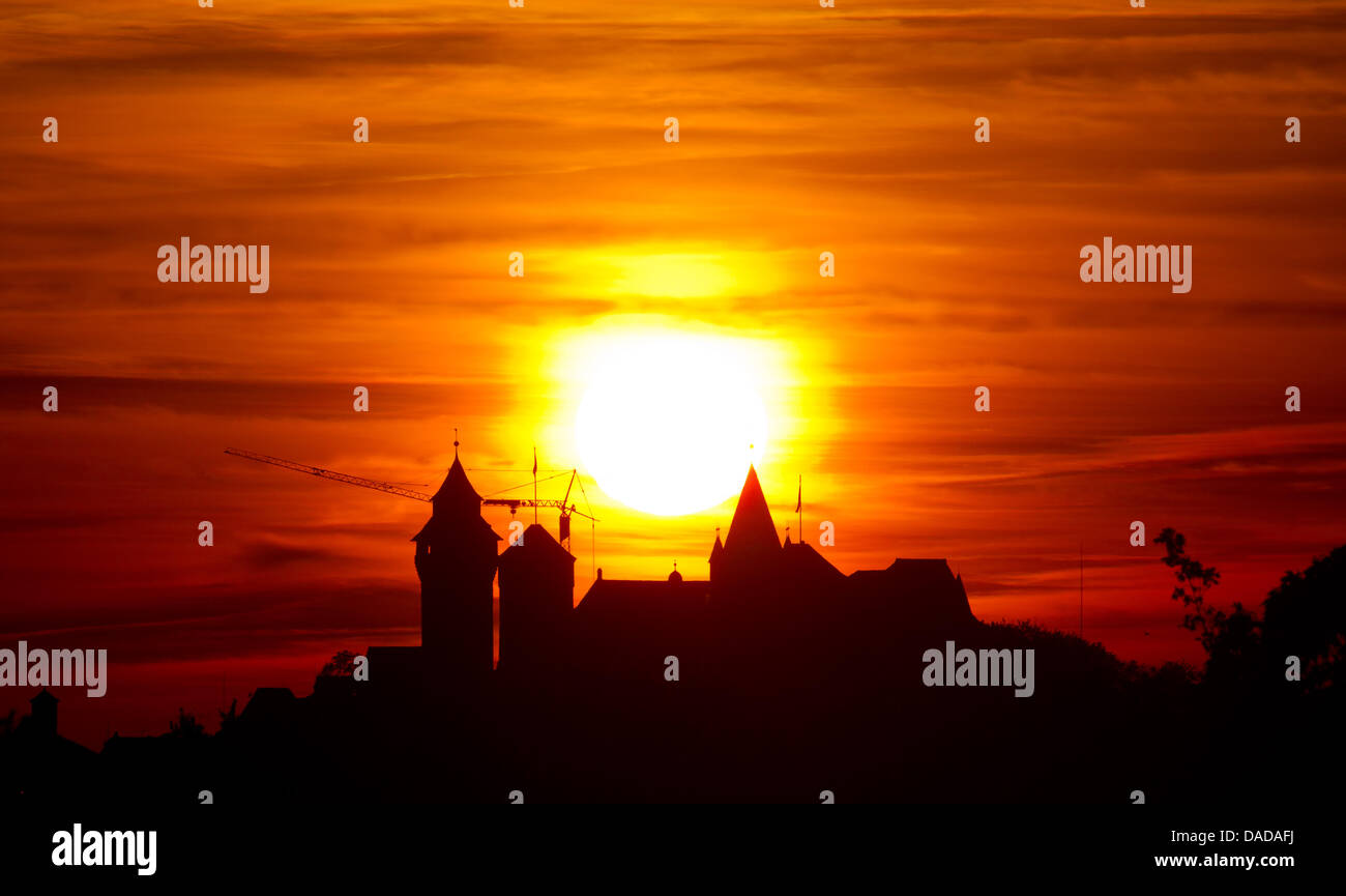 Thr silhouette of the Kaiser Castle (Emperor Castle) appears against ...