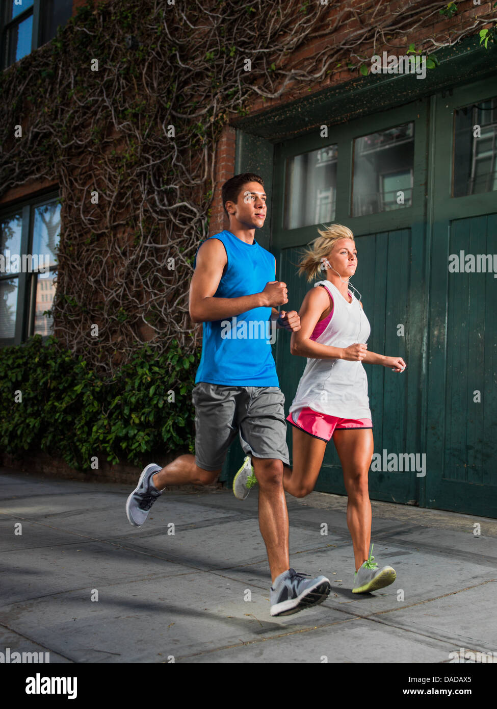Man woman running hi-res stock photography and images - Alamy