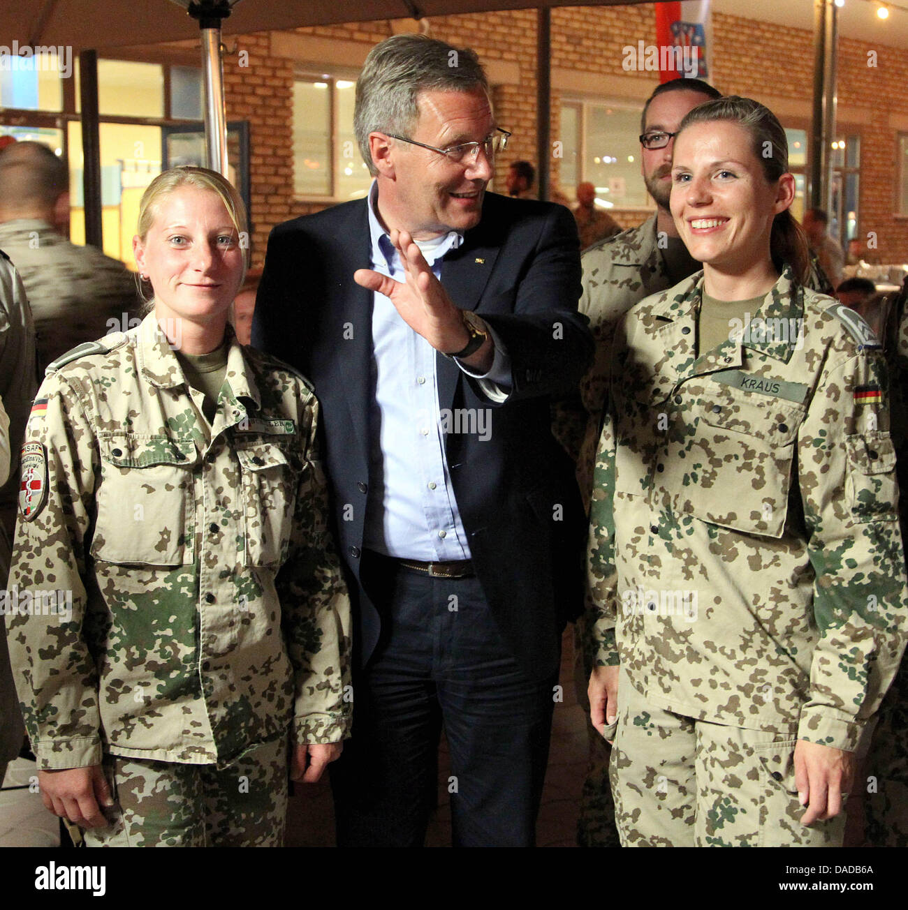 German President Christian Wulff talks to German soldiers during a ...
