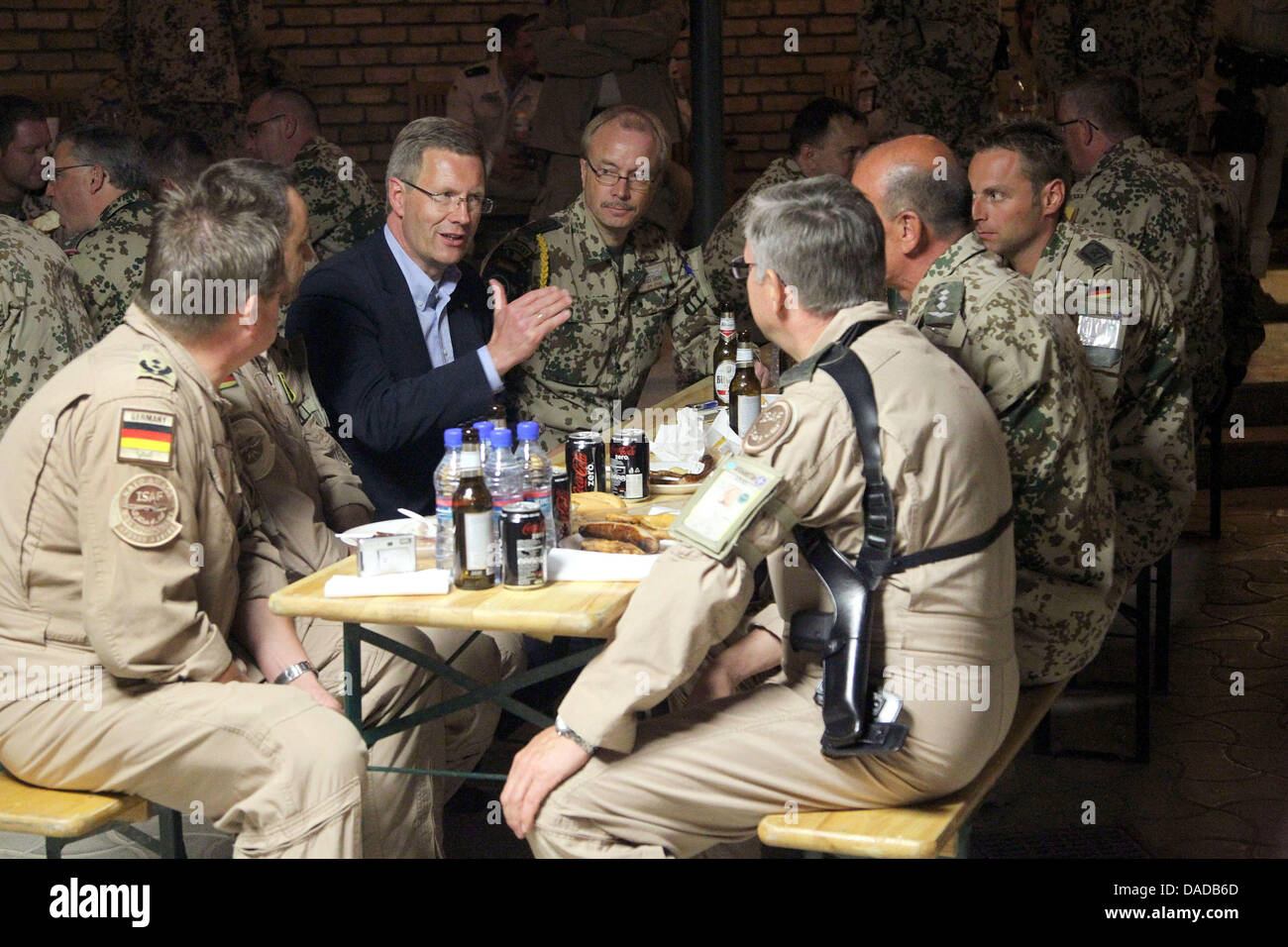 German President Christian Wulff talks to German soldiers during a ...