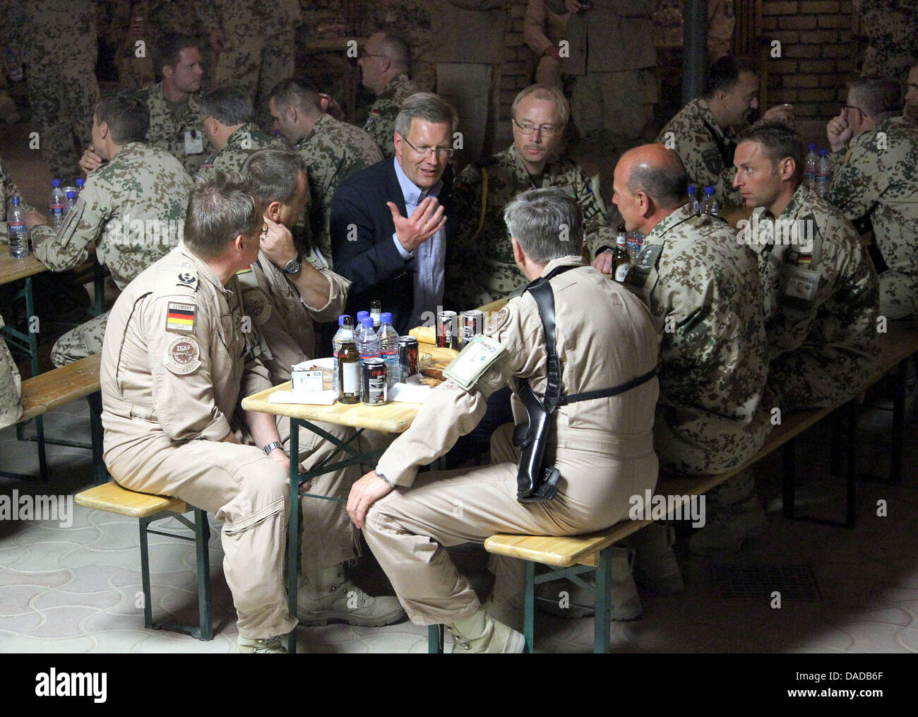 German President Christian Wulff talks to German soldiers during a ...