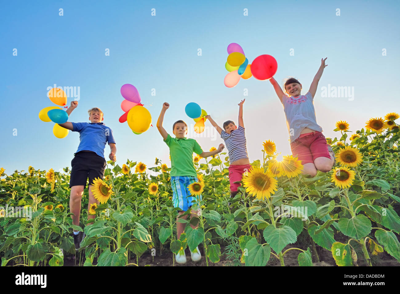 Kids jumping for joy hi-res stock photography and images - Alamy