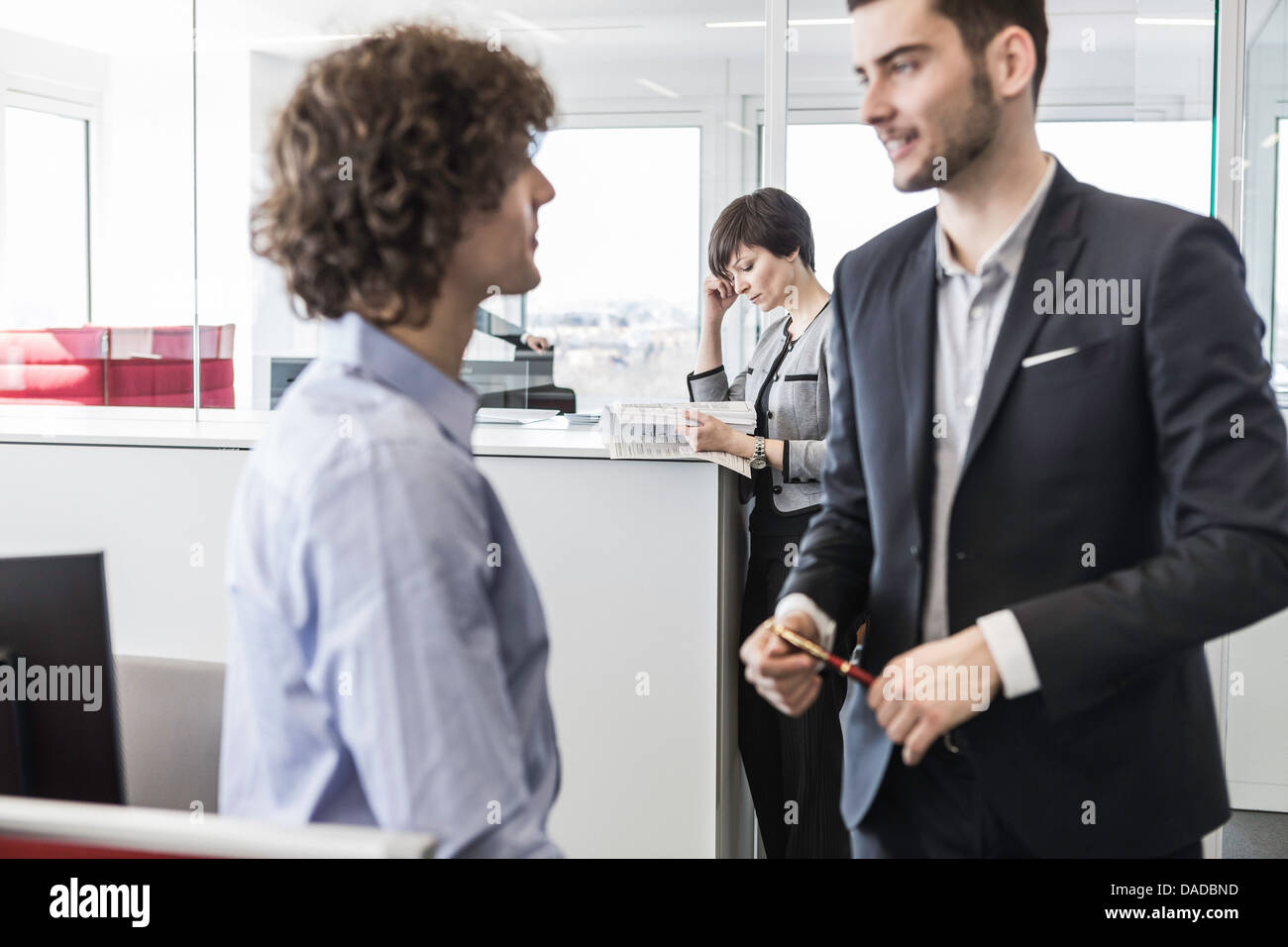 Businessmen in background hi-res stock photography and images - Alamy