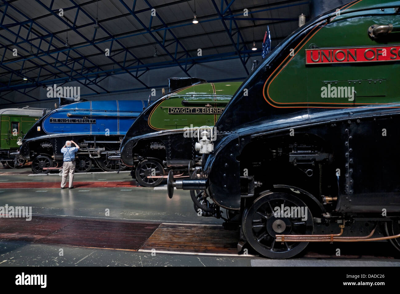 Man photographing one of the A4 Pacific Steam Train engine locomotive ...