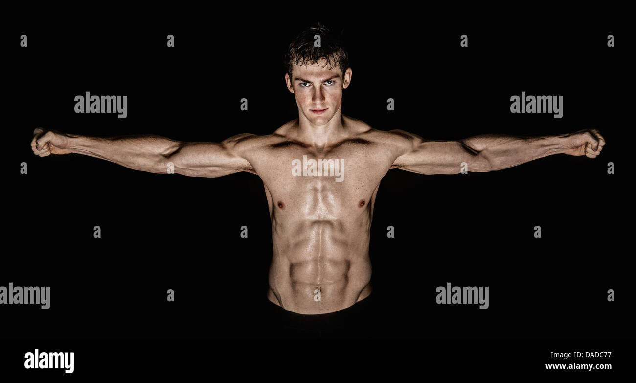 Body builder with outstretched arms showing off pectoral muscles Stock ...